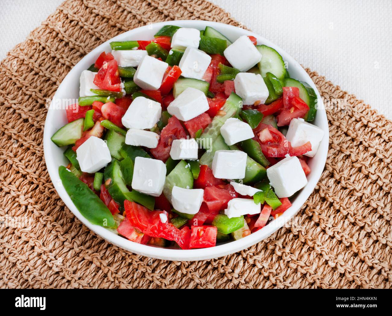Simple Bulgarian Shopska type salad with tomato, cucumbers, peppers and ...