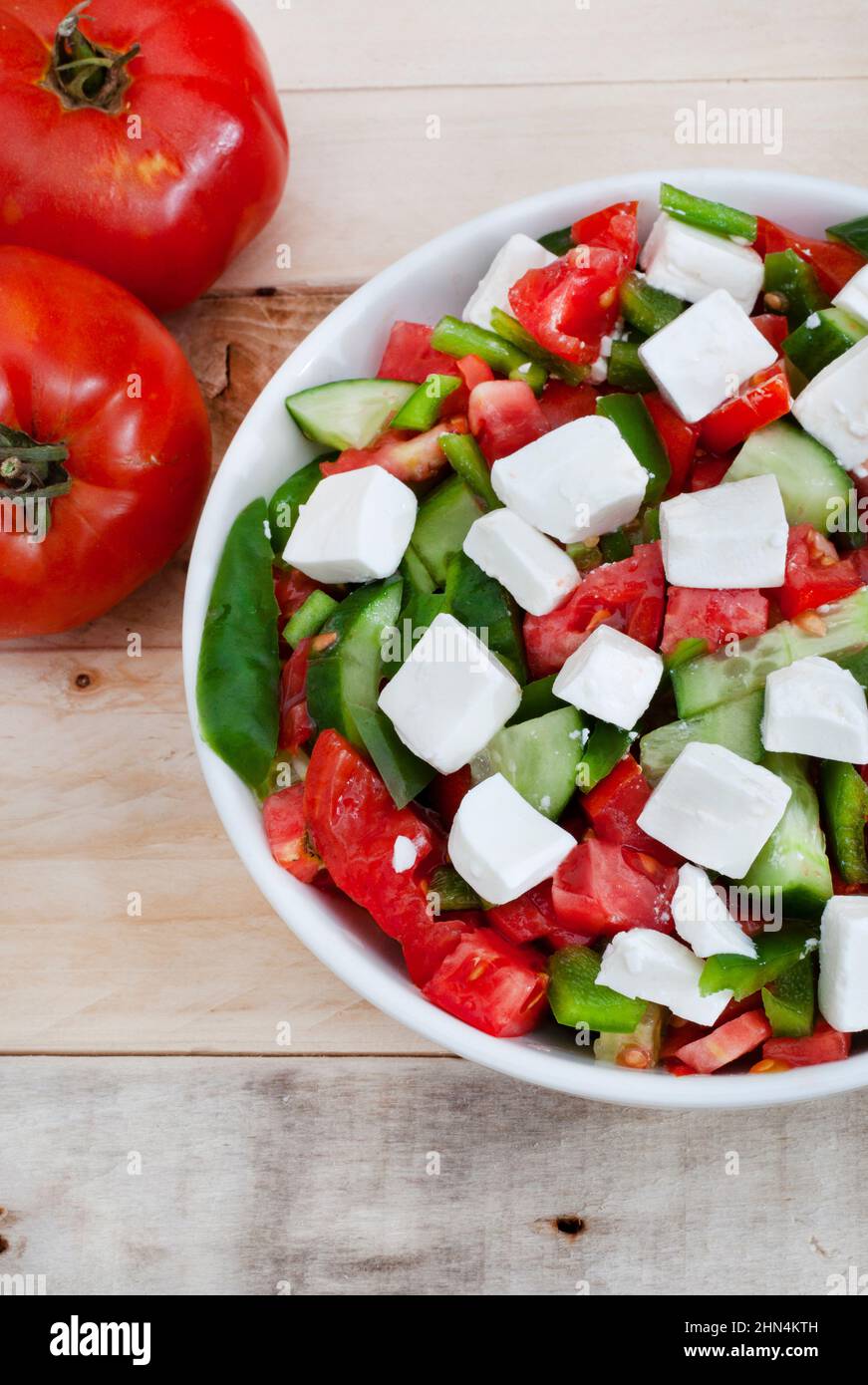 Simple Bulgarian Shopska type salad with tomato, cucumbers, peppers and ...
