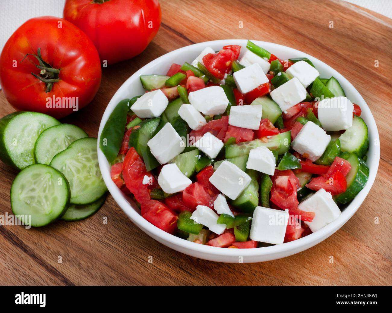Simple Bulgarian Shopska type salad with tomato, cucumbers, peppers and ...