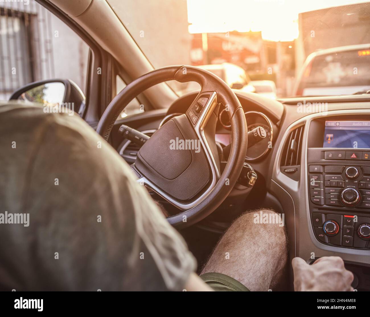 Man driving in the car with sun flare throught window Stock Photo - Alamy