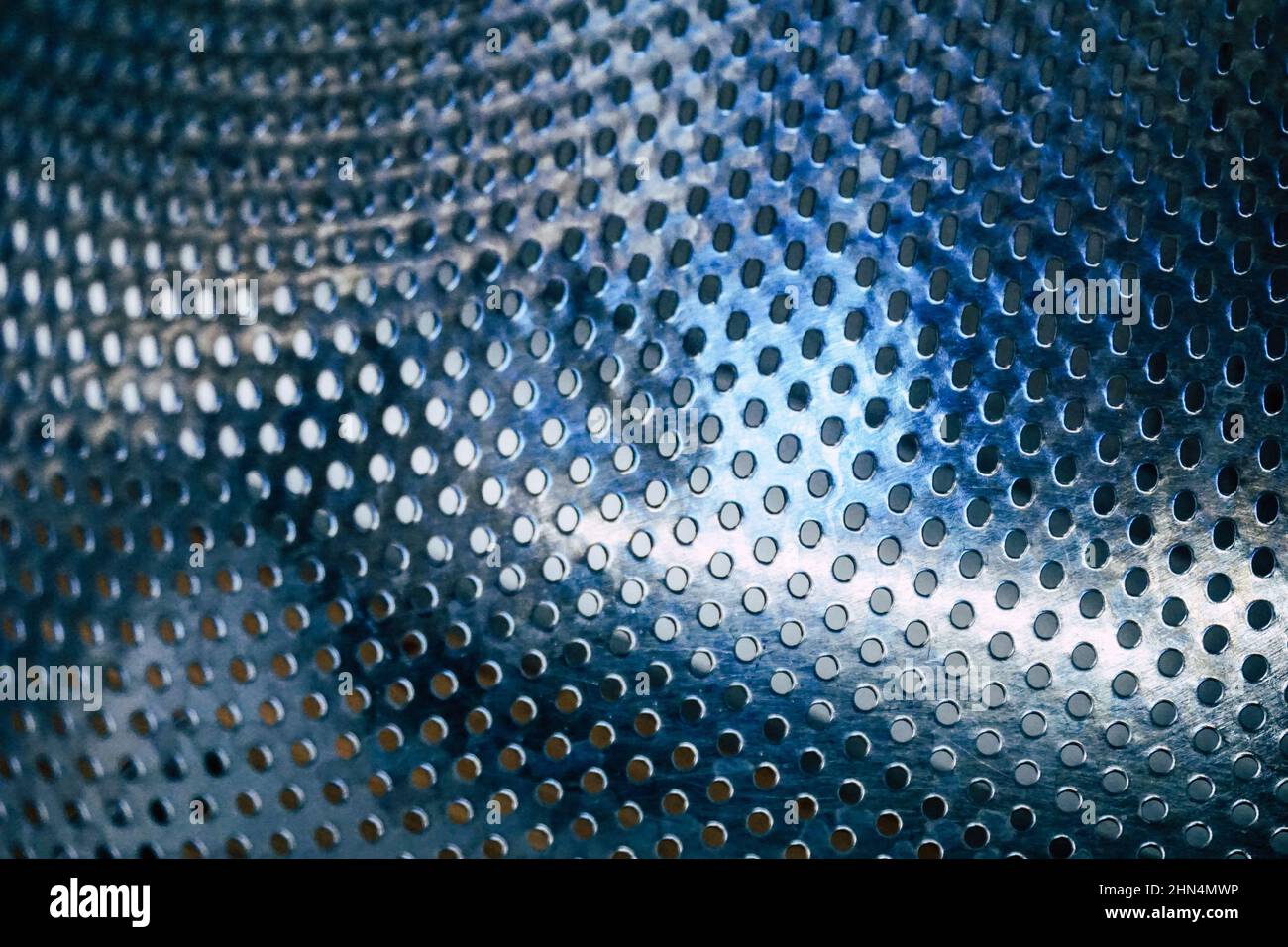Metal texture with multiple wholes - background Stock Photo - Alamy