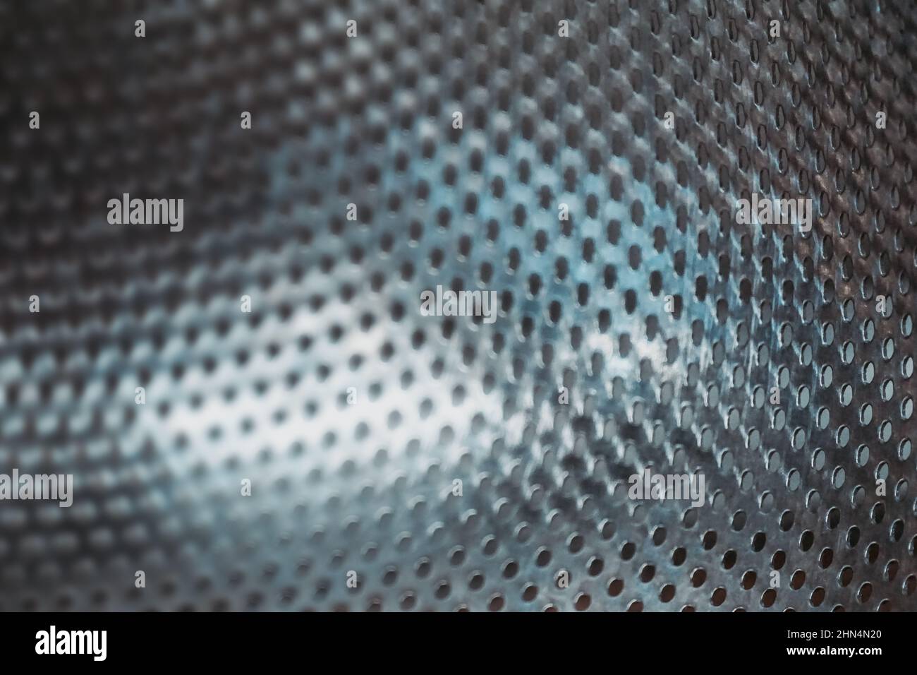 Metal texture with multiple wholes - background Stock Photo - Alamy