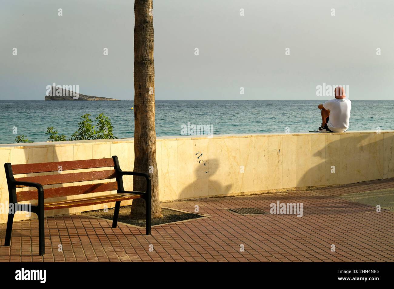 A man looking Benidorm Island from Mediterranean Balcony Stock Photo ...