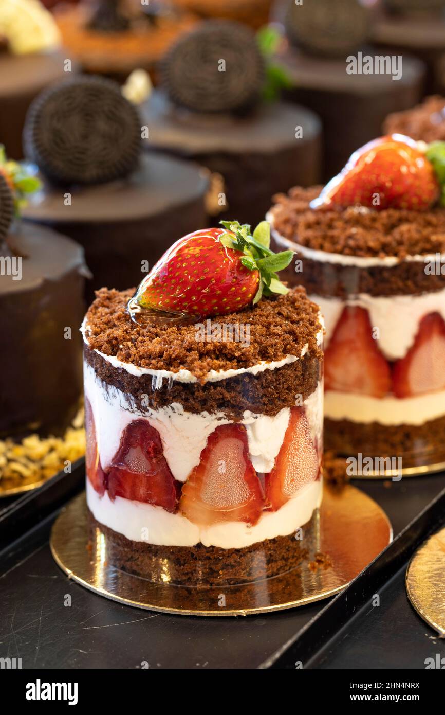 Fruity cake. Small cakes on display at the patisserie counter Stock ...