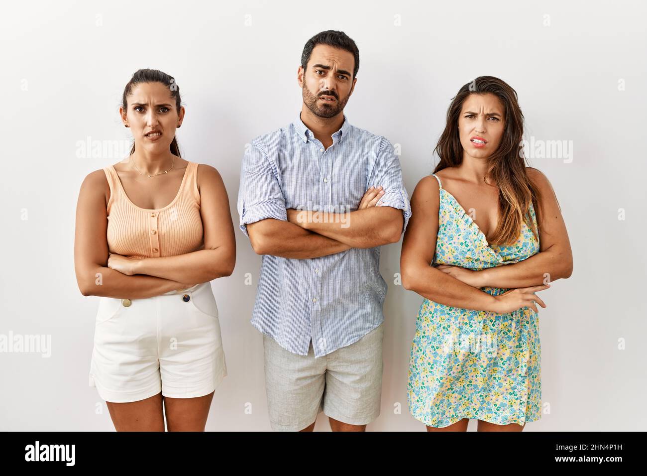 Group of young hispanic people standing over isolated background ...