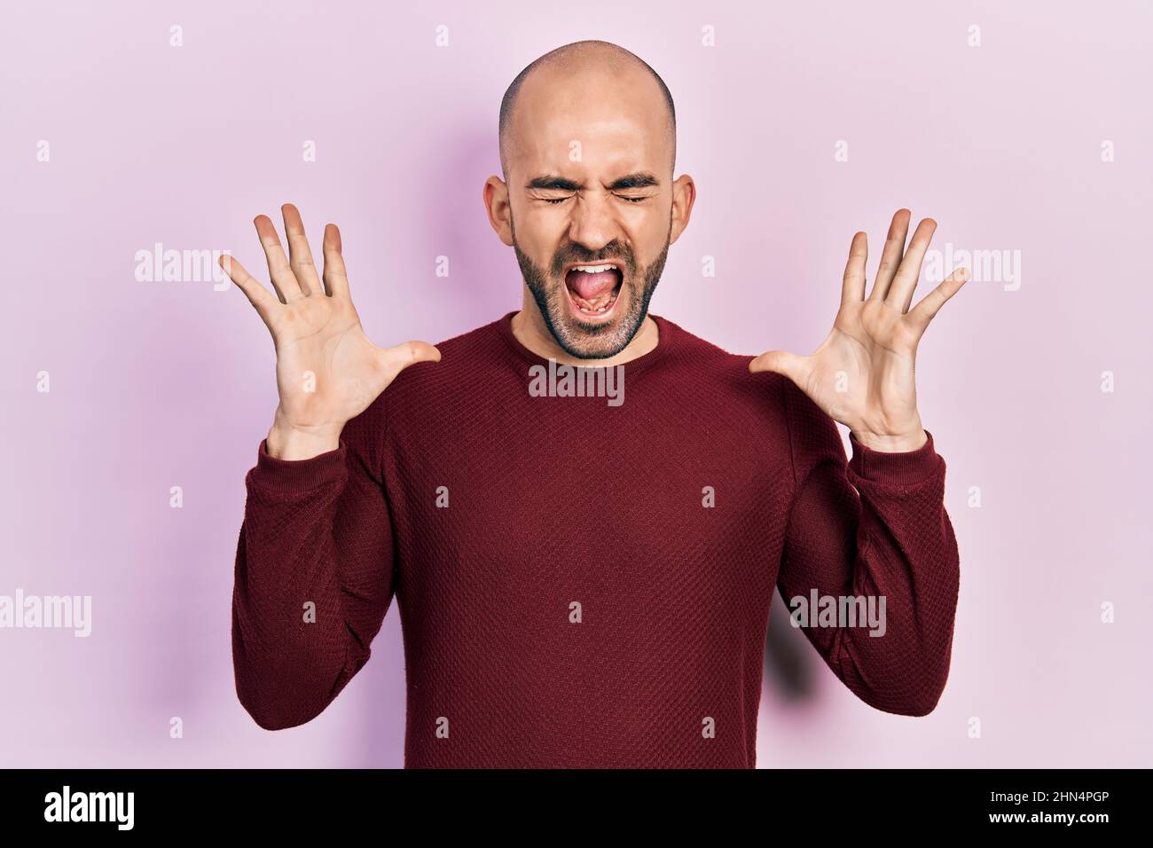 Young bald man wearing casual clothes celebrating mad and crazy for ...