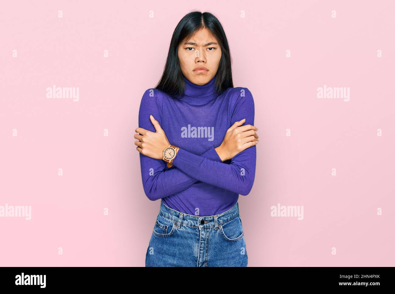 Beautiful young asian woman wearing casual clothes shaking and freezing ...