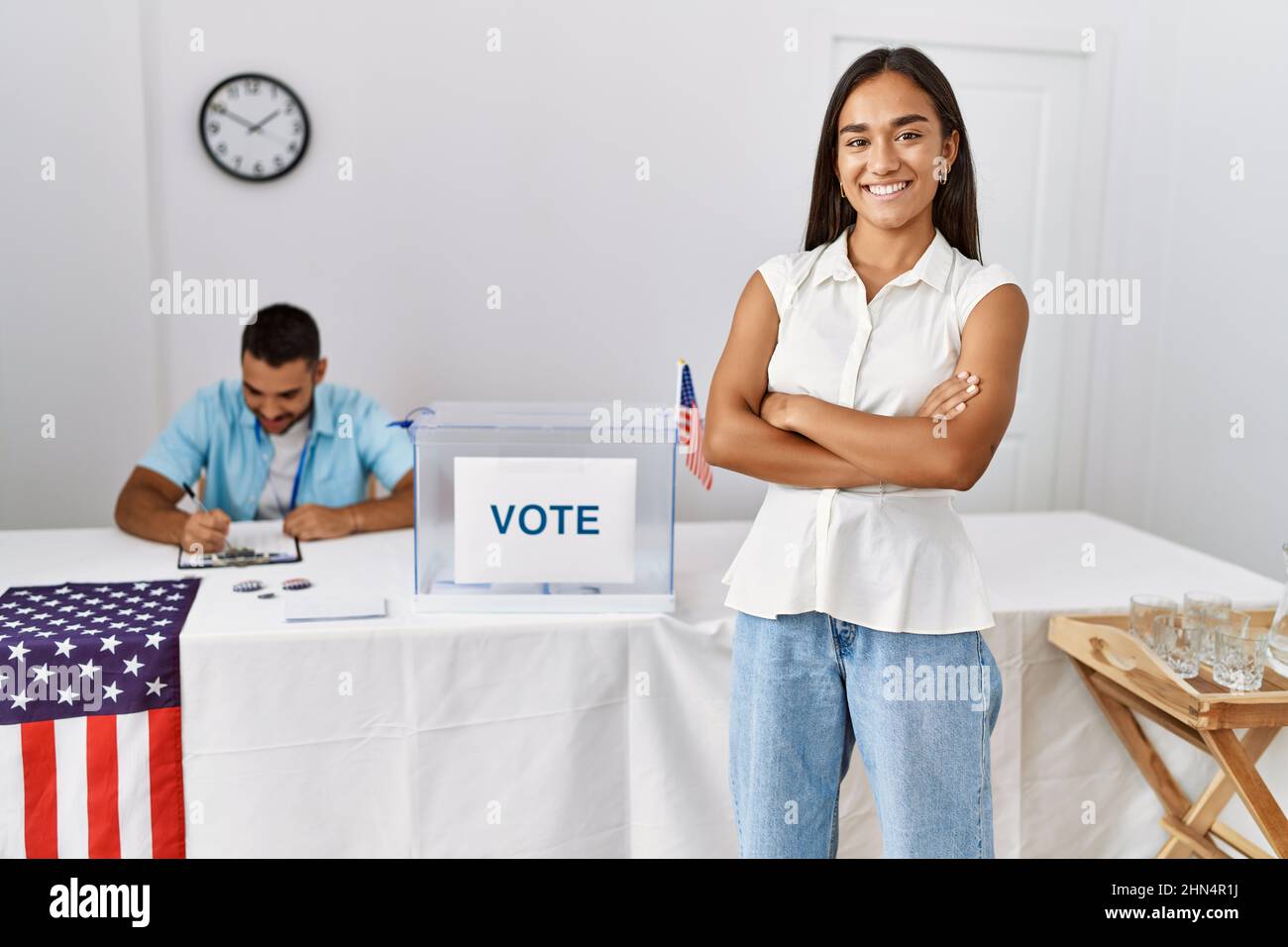 Young american voter woman smiling happy standing with arms crossed ...