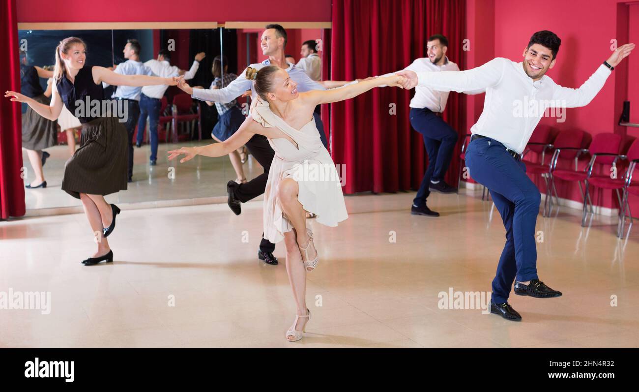 Adult dancing couples enjoying active swing Stock Photo - Alamy
