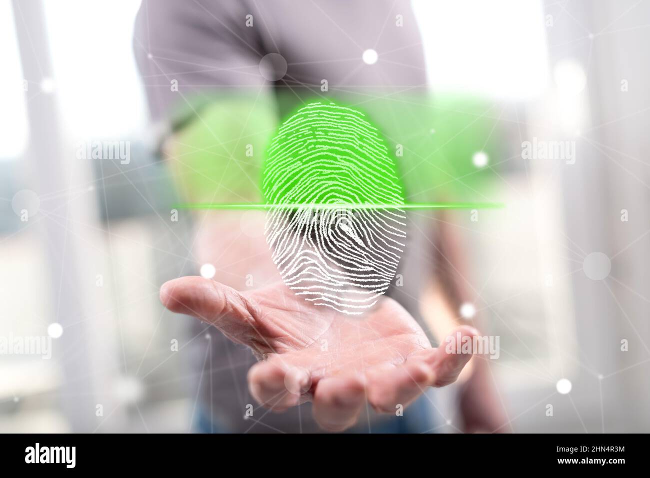 Fingerprint security system concept above the hand of a man in ...