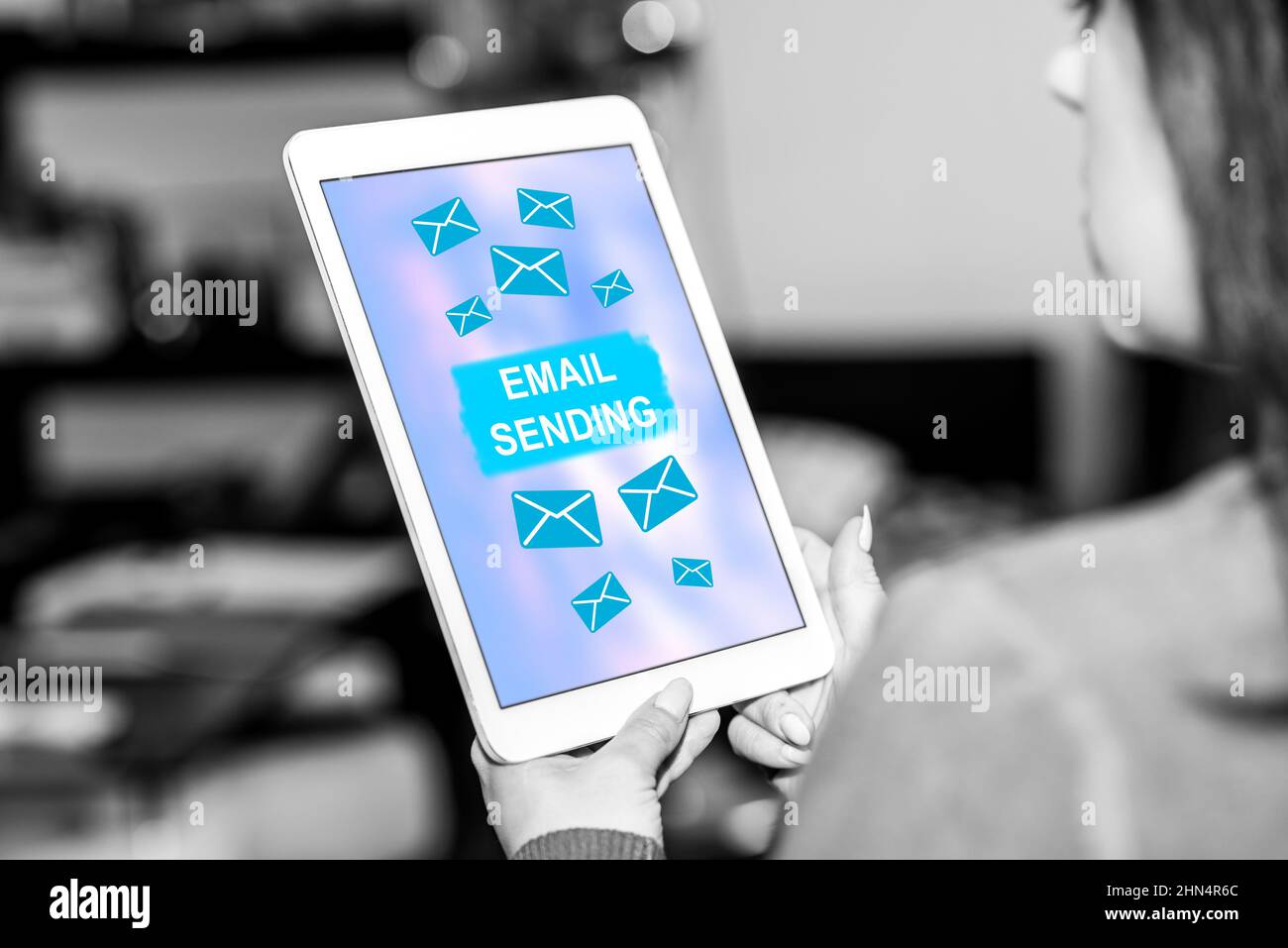 Tablet screen displaying an email sending concept Stock Photo - Alamy