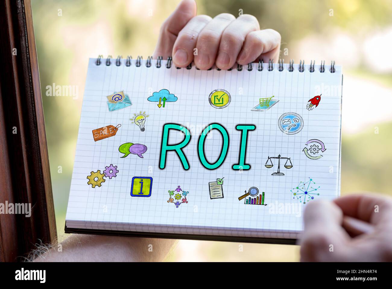 Hand drawing roi concept on a notepad Stock Photo - Alamy