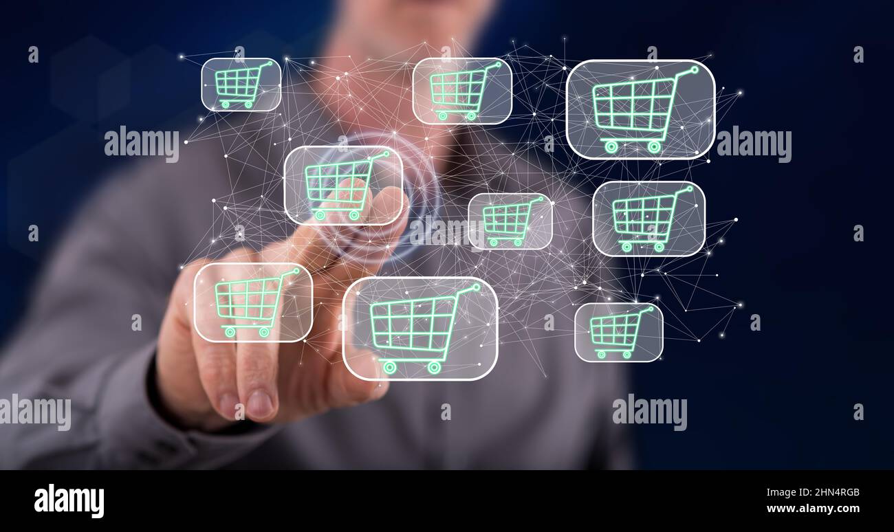 Man touching an online shopping concept on a touch screen with his ...