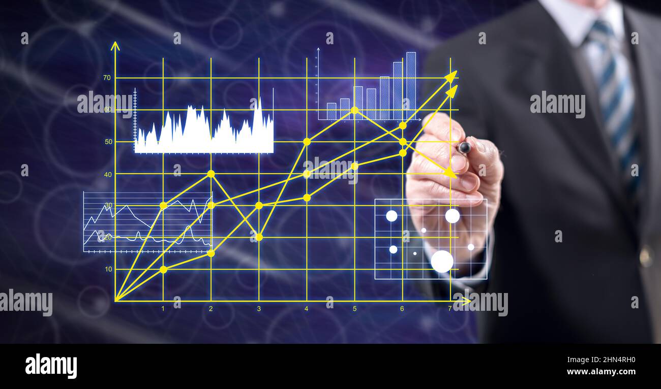 Man touching business charts on a touch screen with a stylus pen Stock ...