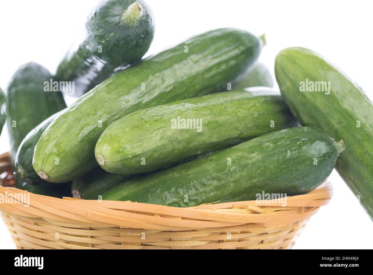 Fresh mini cucumbers in a basket Stock Photo - Alamy