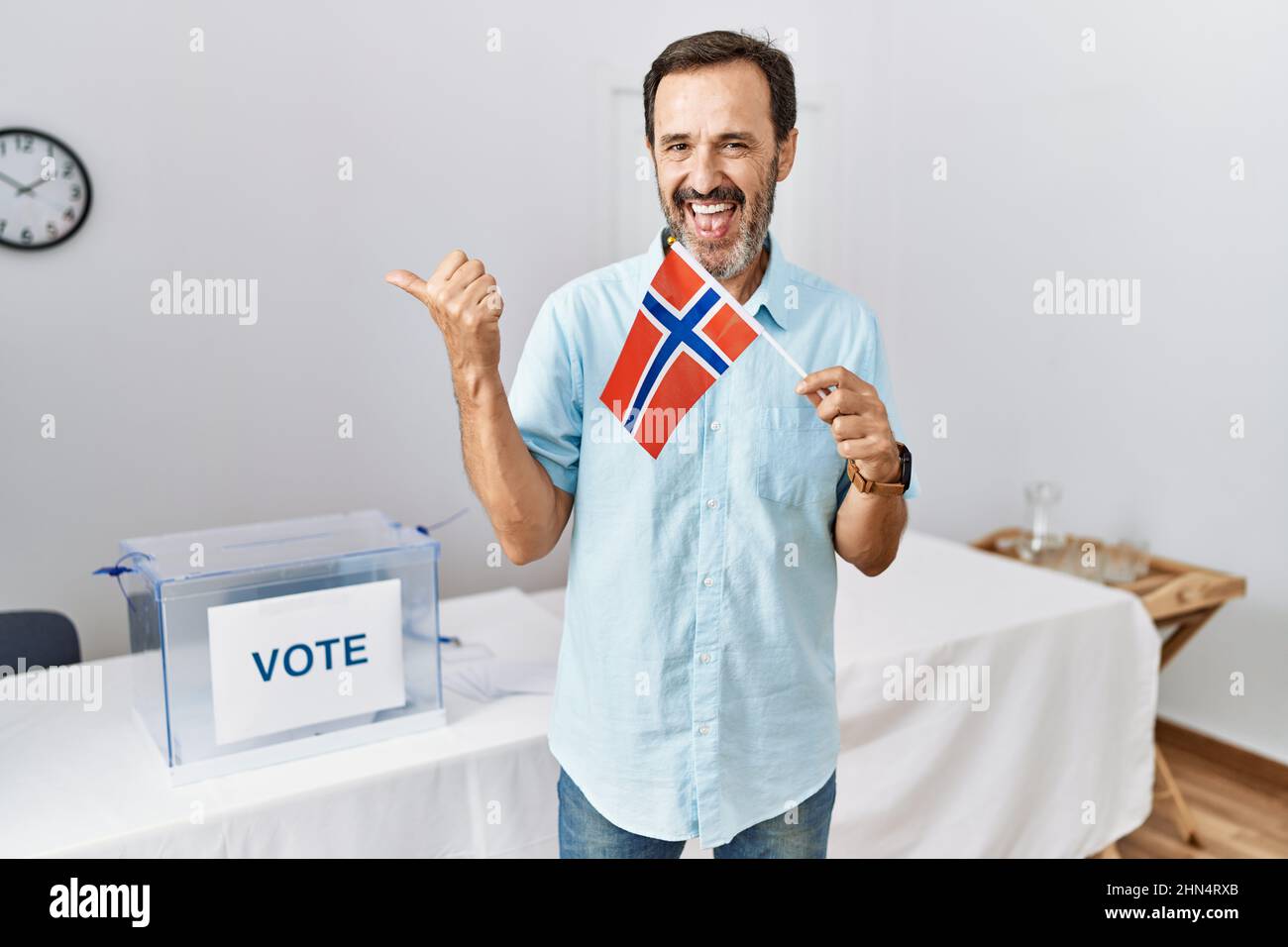 Middle age man with beard at political campaign election holding norway ...
