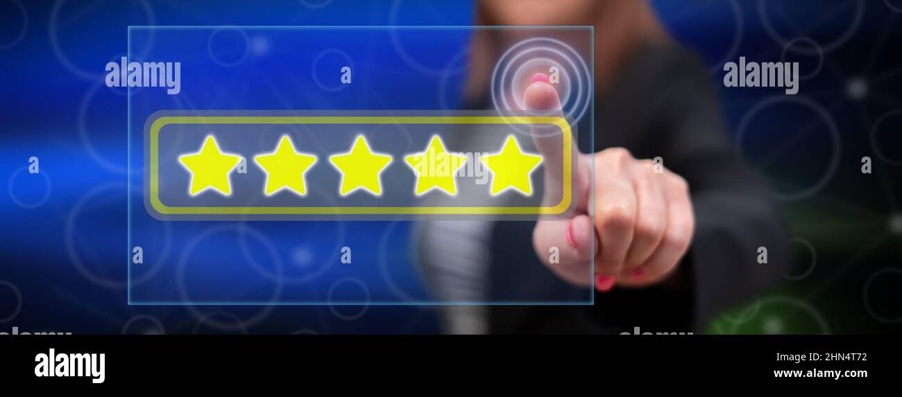 Woman touching a quality concept on a touch screen with her finger ...