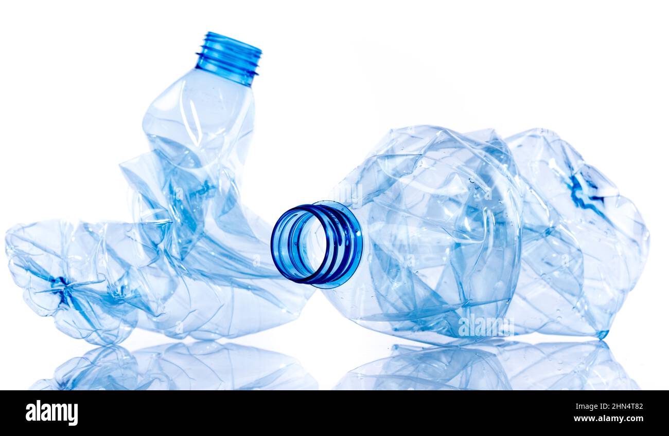 Crushed plastic bottles, isolated on white Stock Photo - Alamy