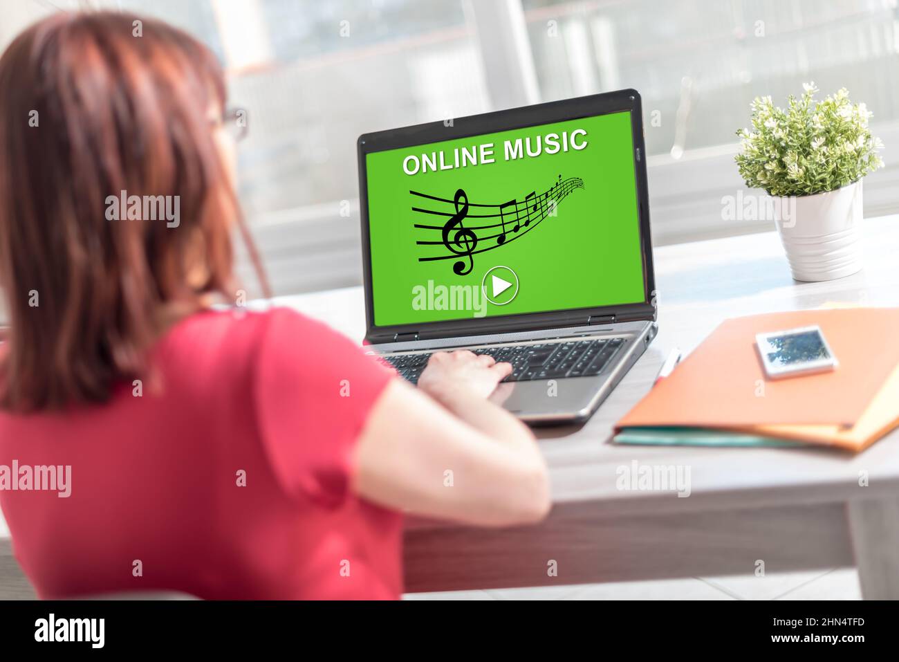 Laptop screen displaying an online music concept Stock Photo - Alamy