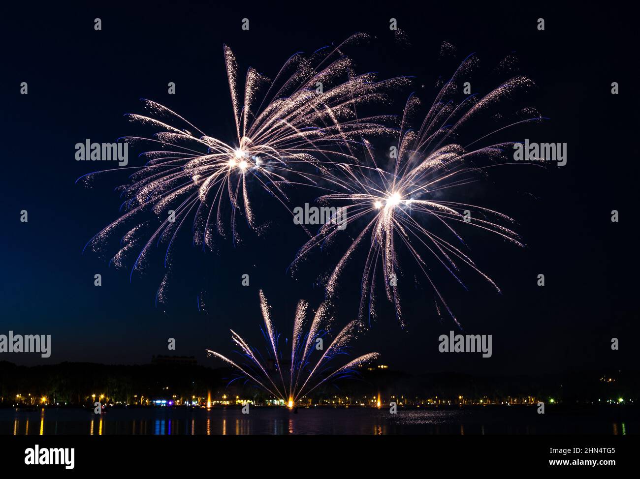 Beautiful fireworks show on a lake Stock Photo - Alamy