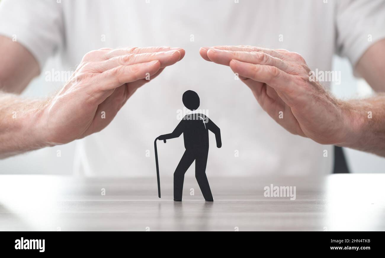 Elderly person protected by hands - Concept of old age insurance Stock ...