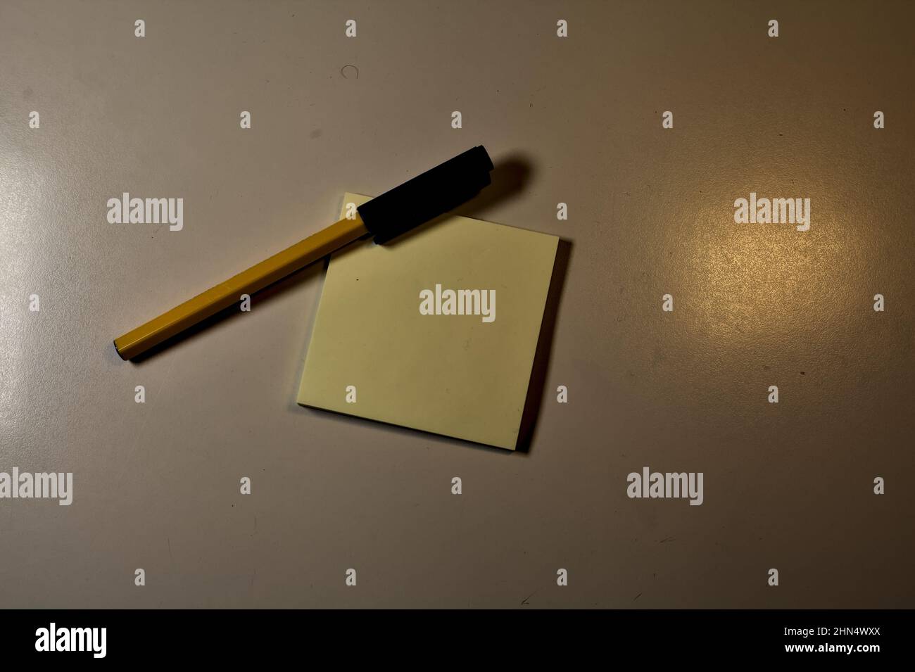Pen and notepaper block on a desk Stock Photo - Alamy