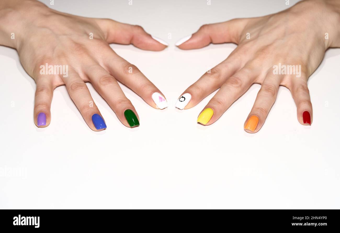 Hands making heart shape with LGBT rainbow flag and rose triangle ...