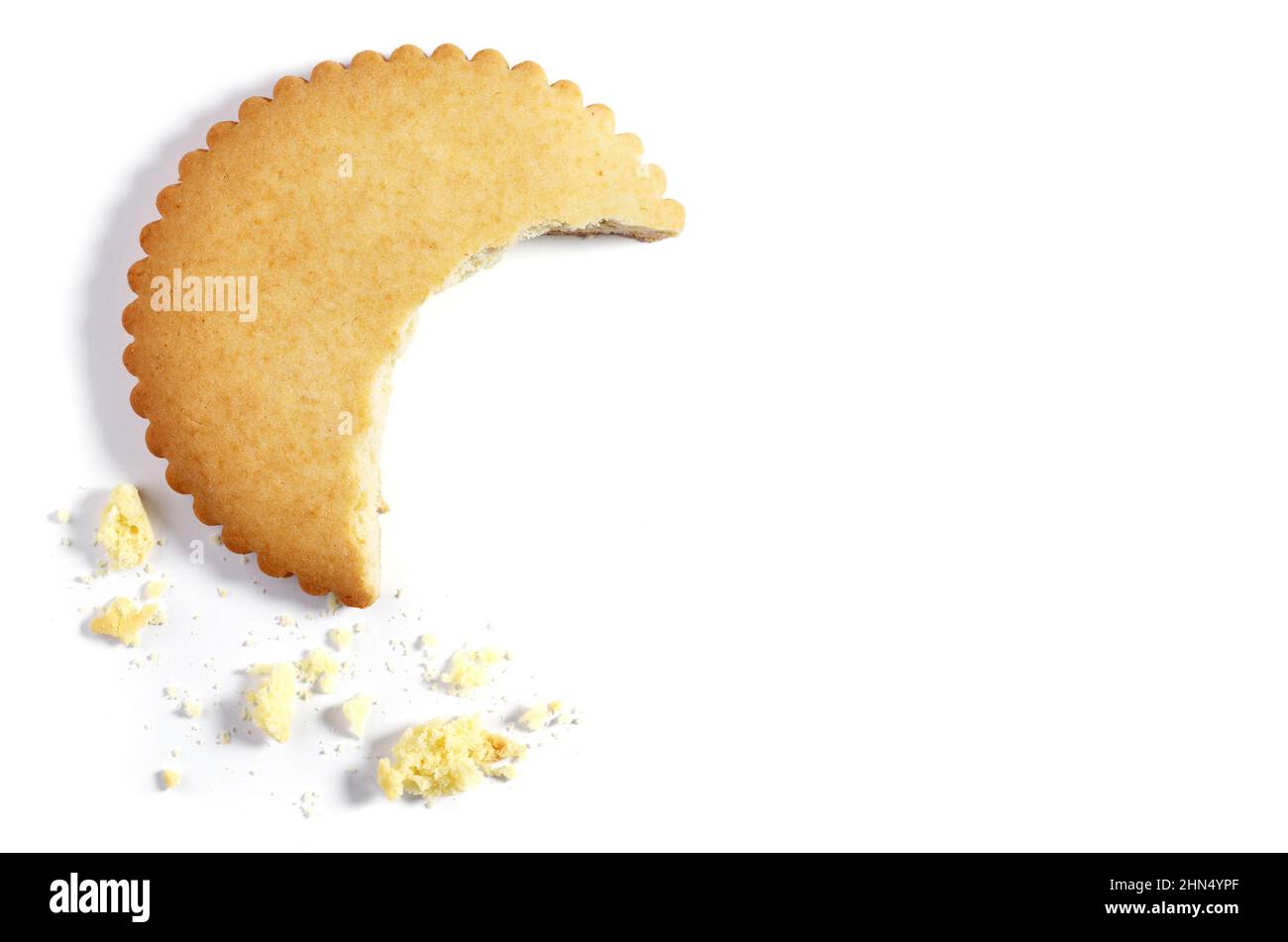 Gingerbread, partially eaten In the form of a crescent and crumbs on a ...