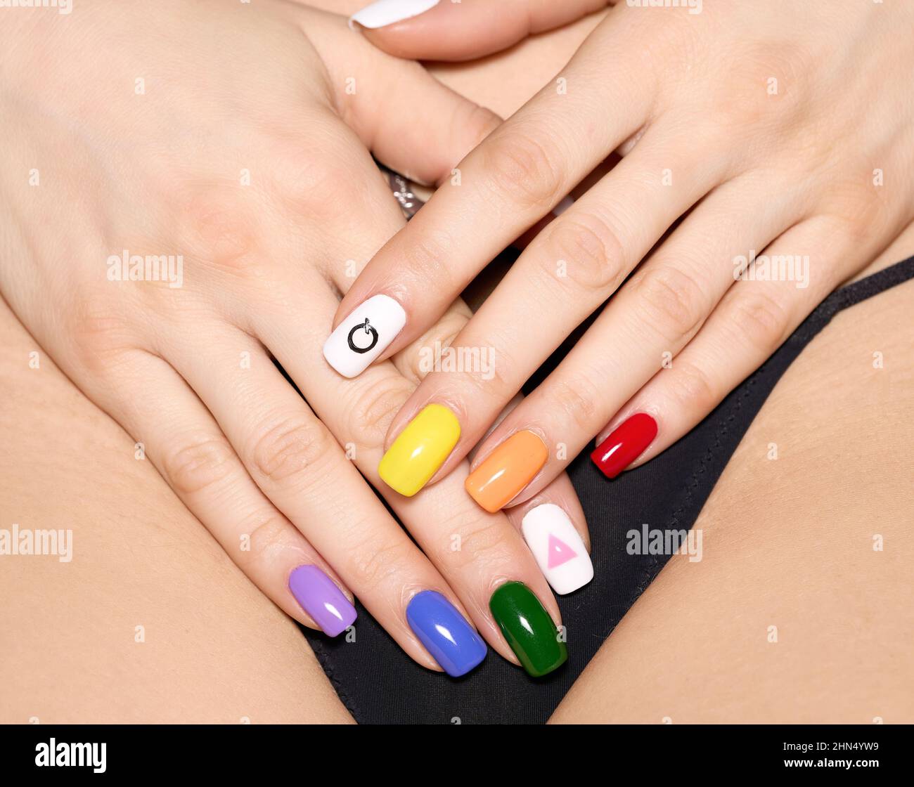 Woman Hands With Lgbt Rainbow Flag And Rose Triangle Manicure Covering
