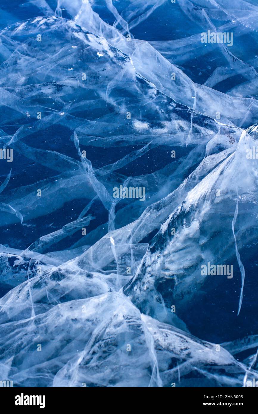 Natural texture of clear blue ice with white cracks. Thick ice and deep ...