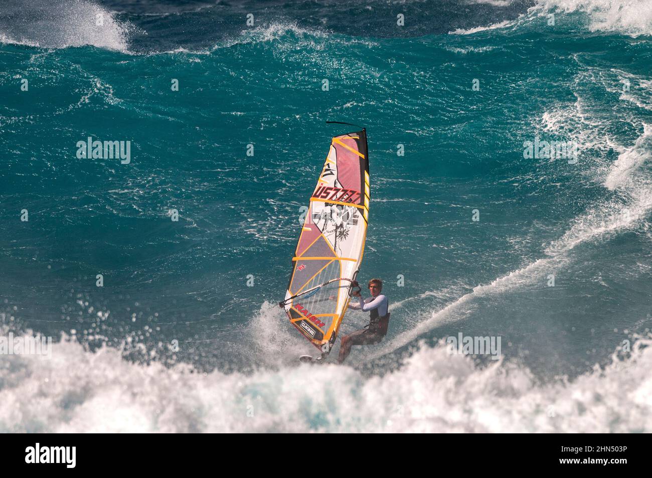 Windsurfer sailing the big waves at Ho'okipa Beach, Maui, Hawaii, USA ...