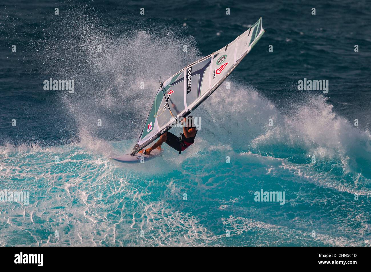 Windsurfer sailing the big waves at Ho'okipa Beach, Maui, Hawaii, USA ...