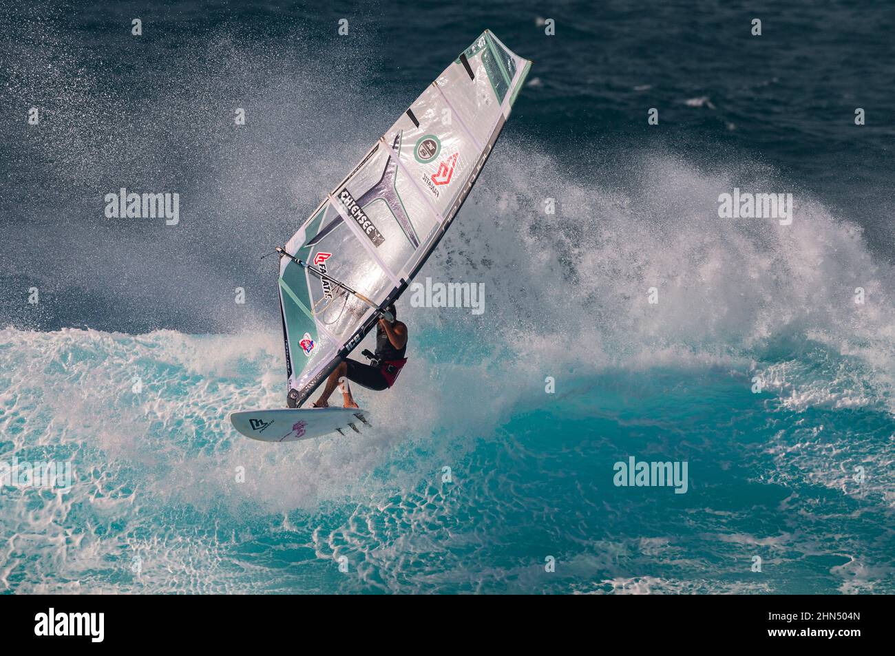 Windsurfer sailing the big waves at Ho'okipa Beach, Maui, Hawaii, USA ...