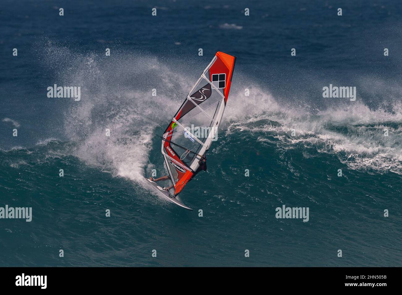 Windsurfer sailing the big waves at Ho'okipa Beach, Maui, Hawaii, USA ...