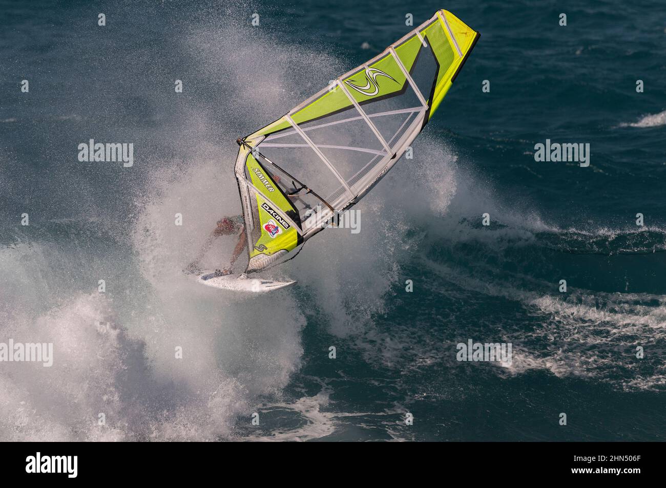 Windsurfer sailing the big waves at Ho'okipa Beach, Maui, Hawaii, USA ...
