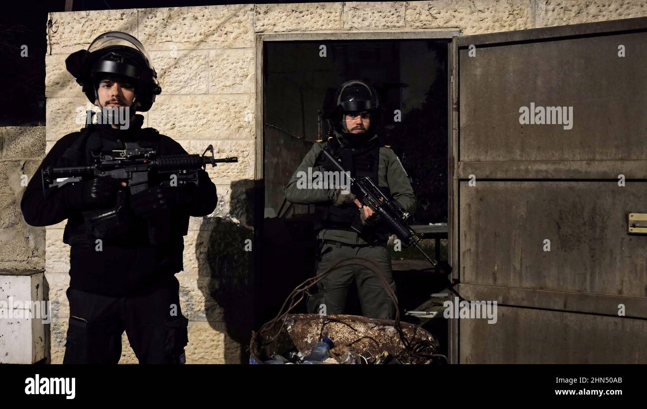 Members of the Israeli Security Forces stand guard in the Sheikh Jarrah ...