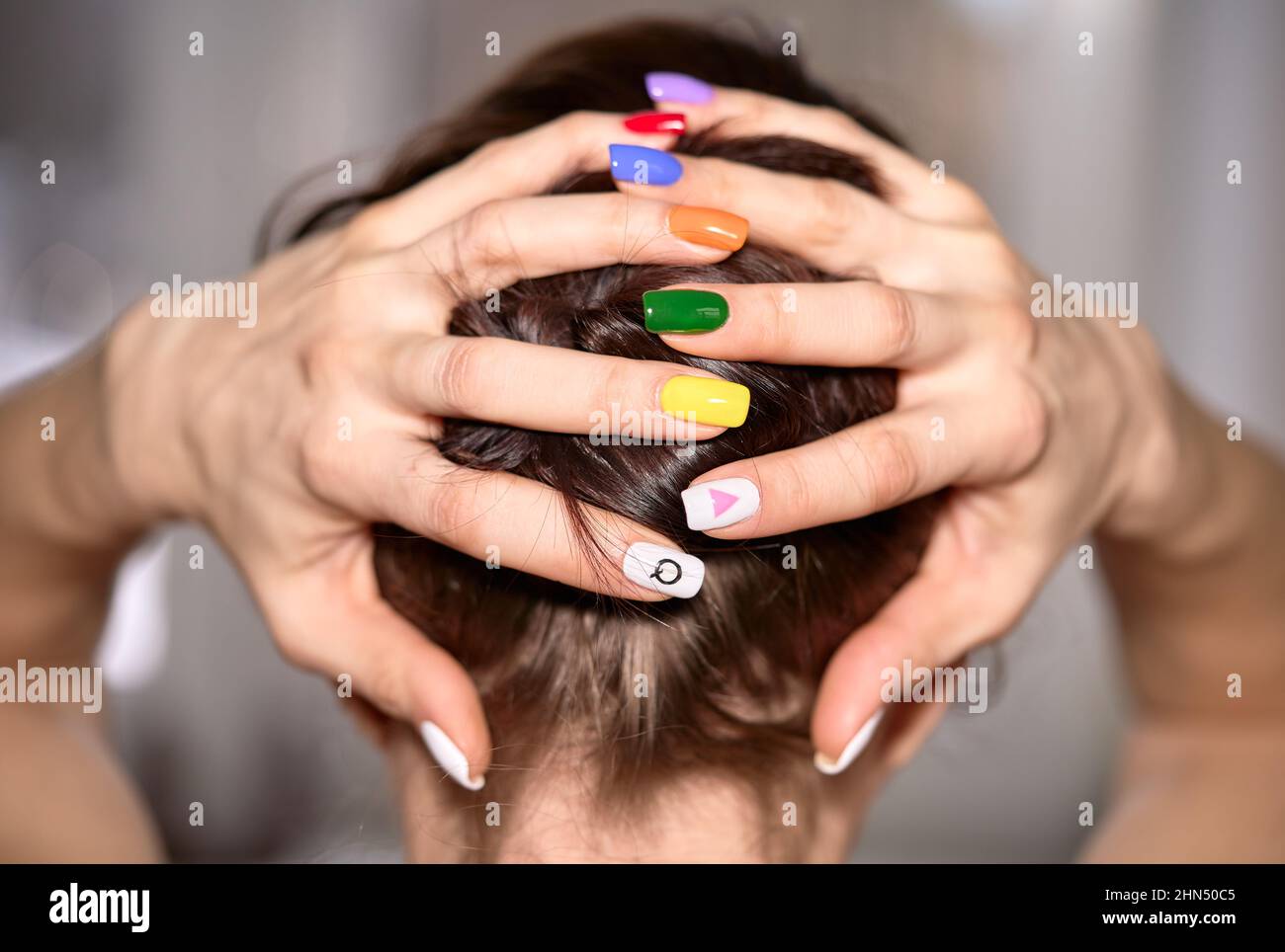 Woman Hands With Lgbt Rainbow Flag And Rose Triangle Manicure Holding