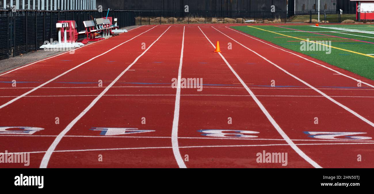 View looking down at a red track from the common start finish line ...