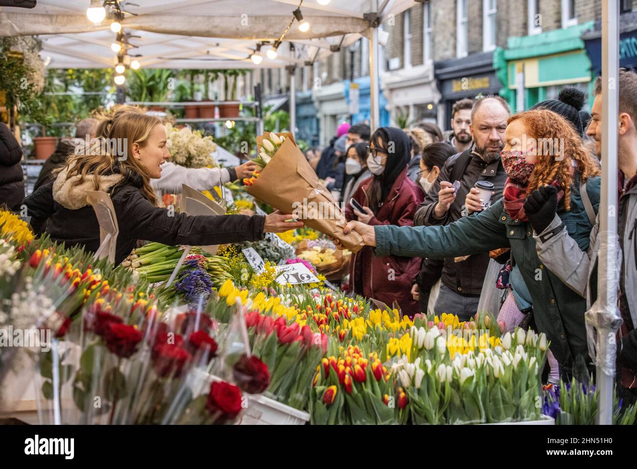 Columbia Road Flower Market busy with exhibitors arranging their flower ...