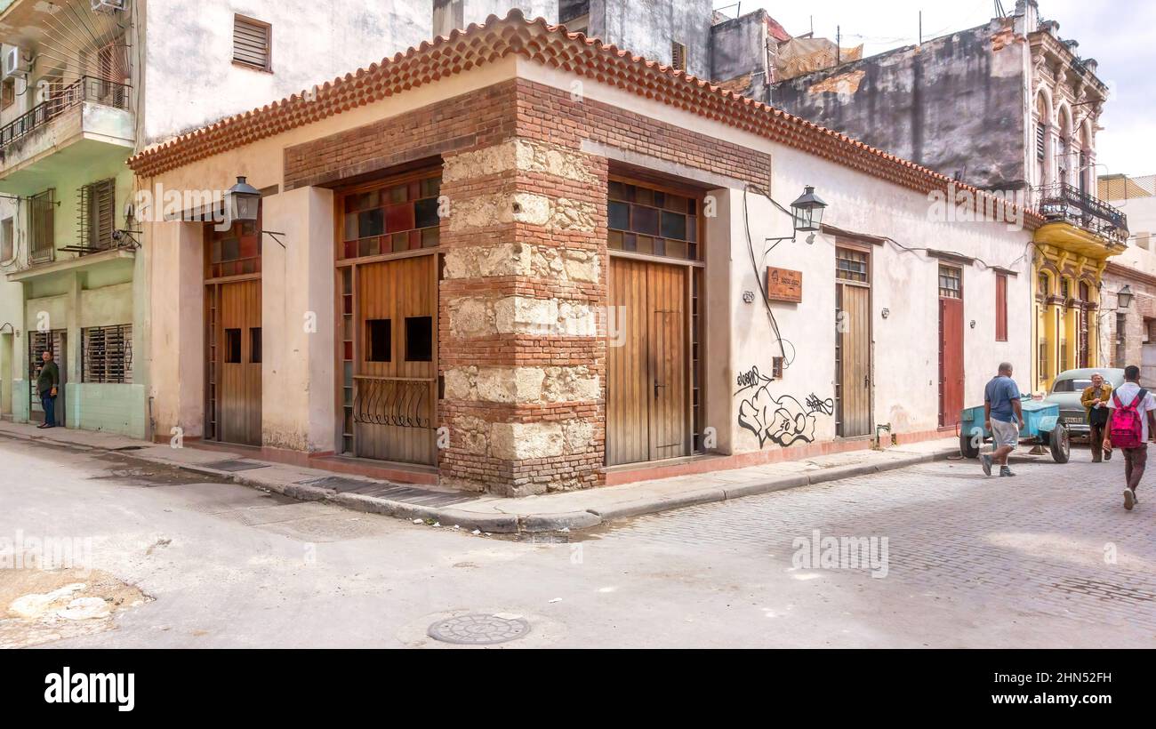 Old building in a city corner. The built structure has an uncovered ...