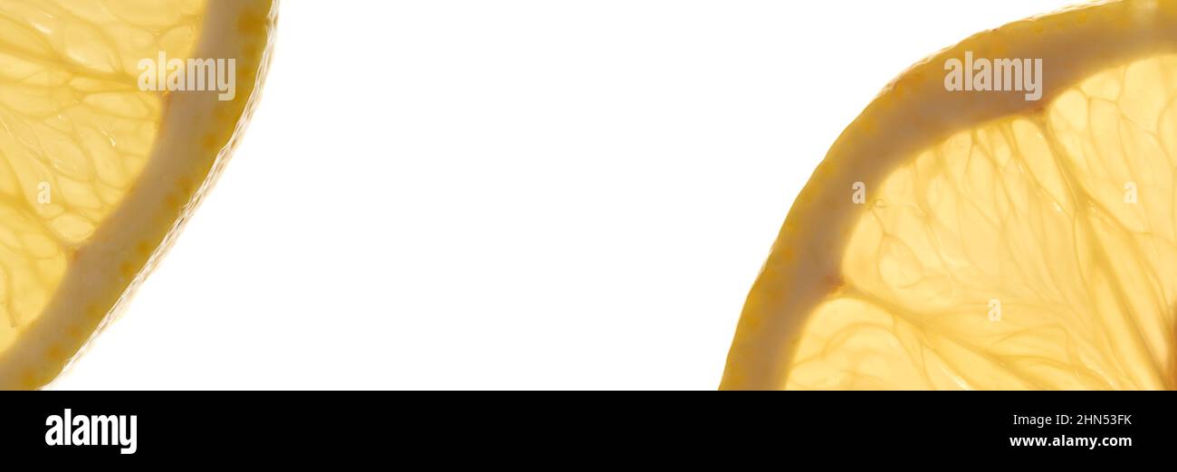 Banner of two slices of lemon on an isolated white background ...