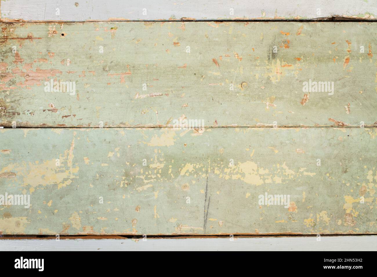 A green wooden texture with bumps and cracks in a close up view Stock ...