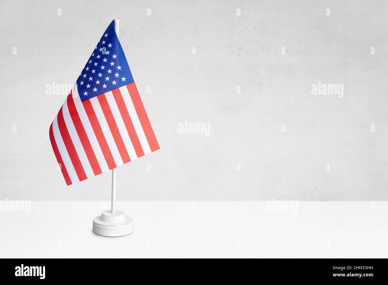 USA american table flag on gray textured wall with Copy space for text ...
