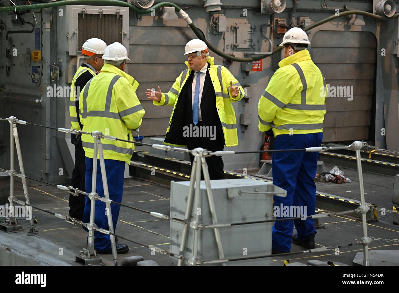 Prime Minister Boris Johnson is shown a vessel undergoing refit for the ...