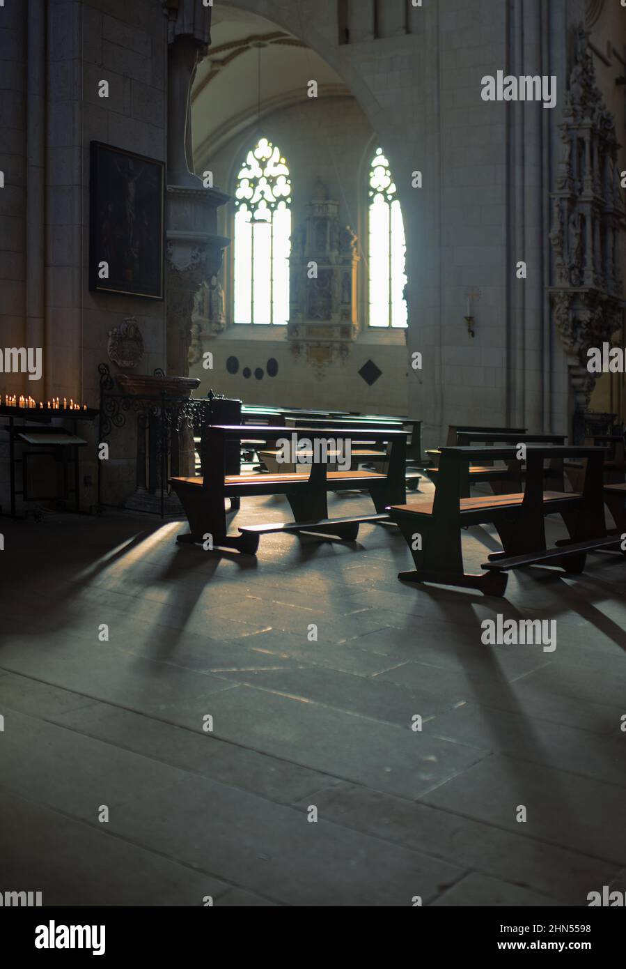 catholic church stained-glass window with sunlight shining through ...