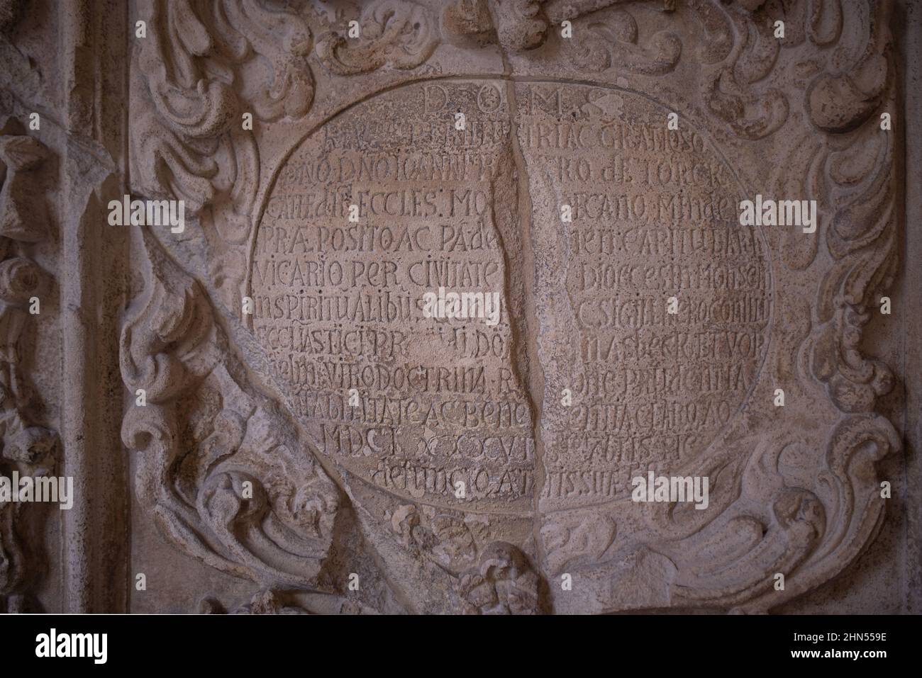 fragment of a stone from the catholic church engraved with latin text ...