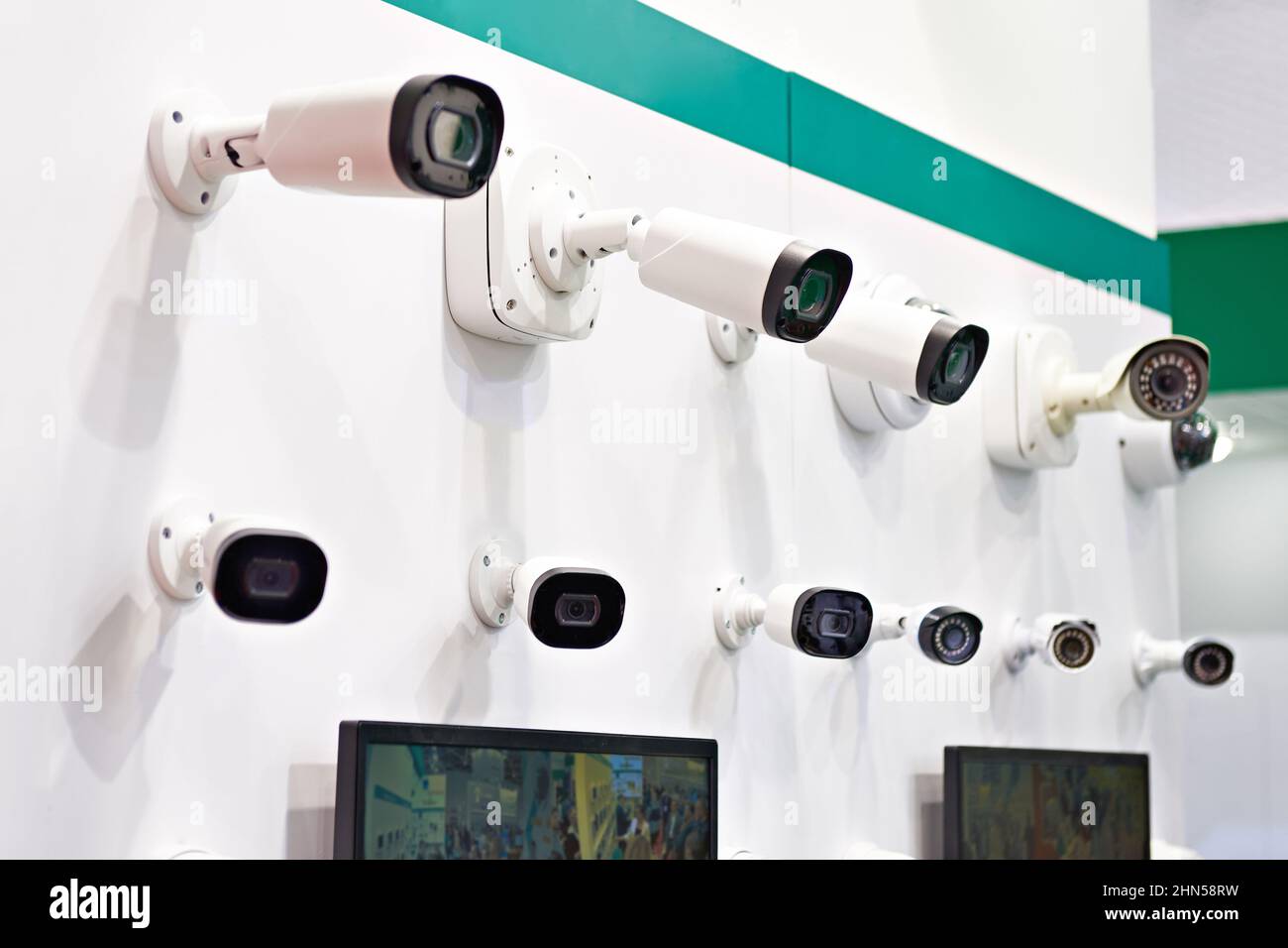 CCTV cameras and monitors on wall exhibition Stock Photo - Alamy