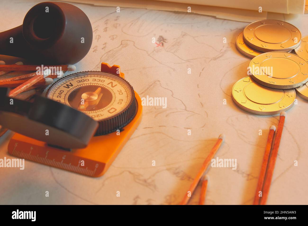 Pirates desk with compass, map, gold coins, tobacco and smoking pipe ...