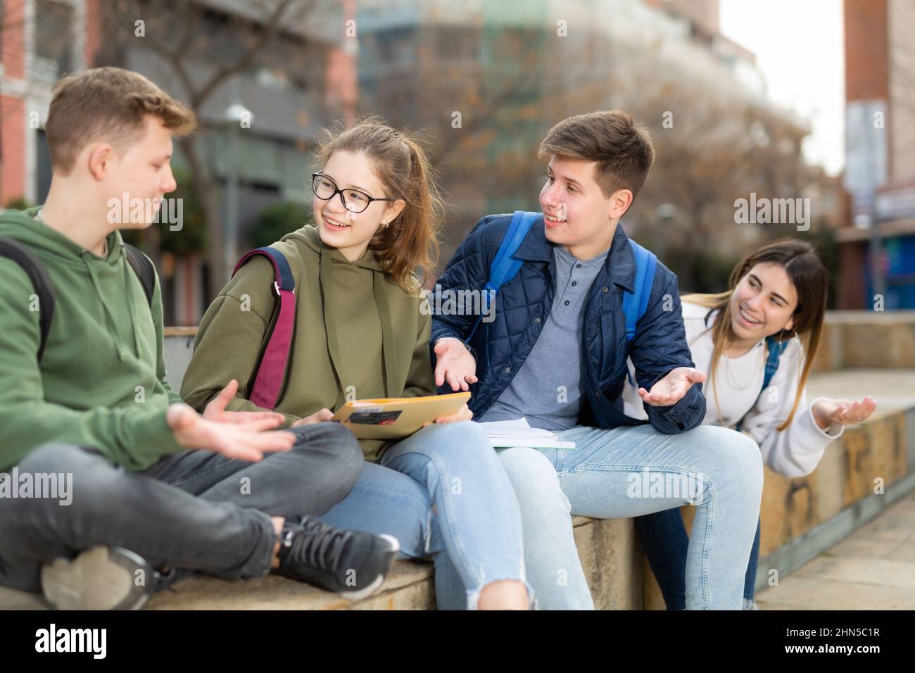 Group of positive teenagers having fun together Stock Photo - Alamy