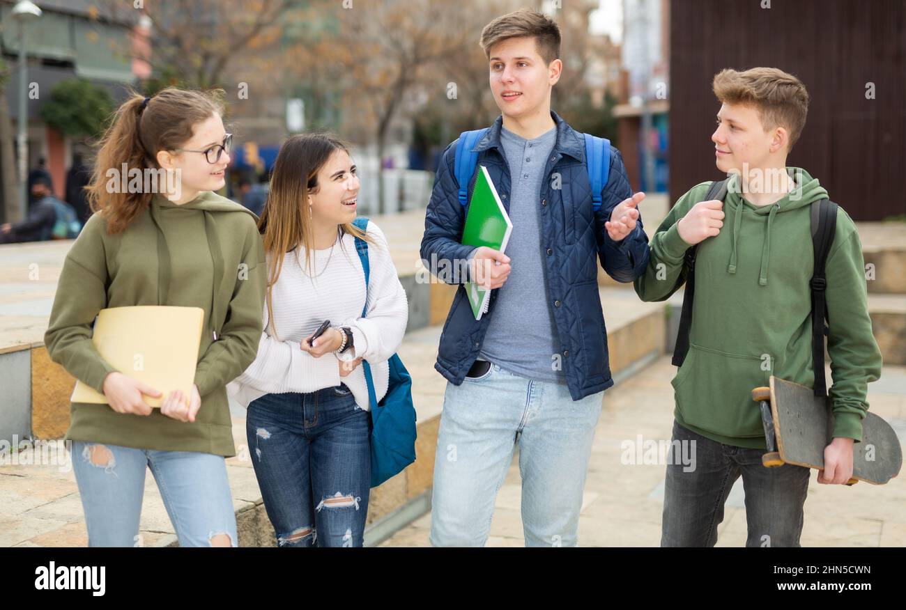 Teenage students talking outside after lessons Stock Photo - Alamy